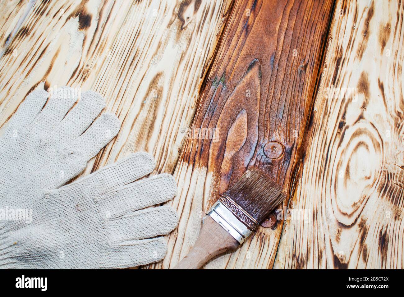 Brush in the brown paint, paint a tree Stock Photo - Alamy