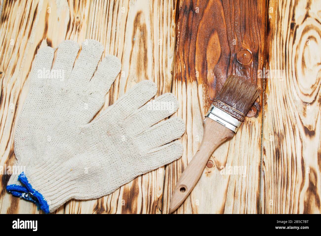 Brush in the brown paint, paint a tree Stock Photo - Alamy