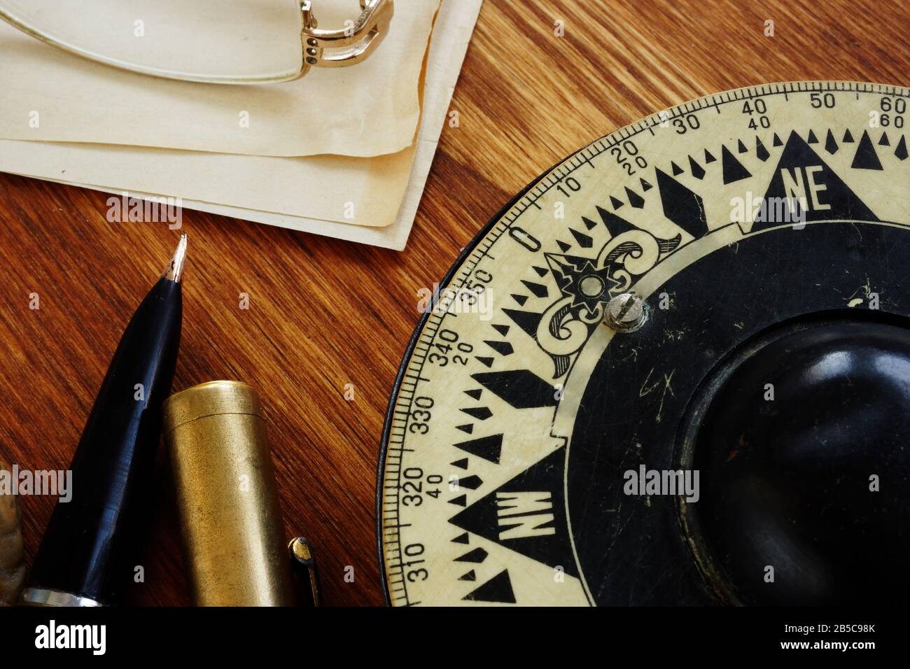 Retro vintage compass, old pen and papers. Adventure concept Stock ...