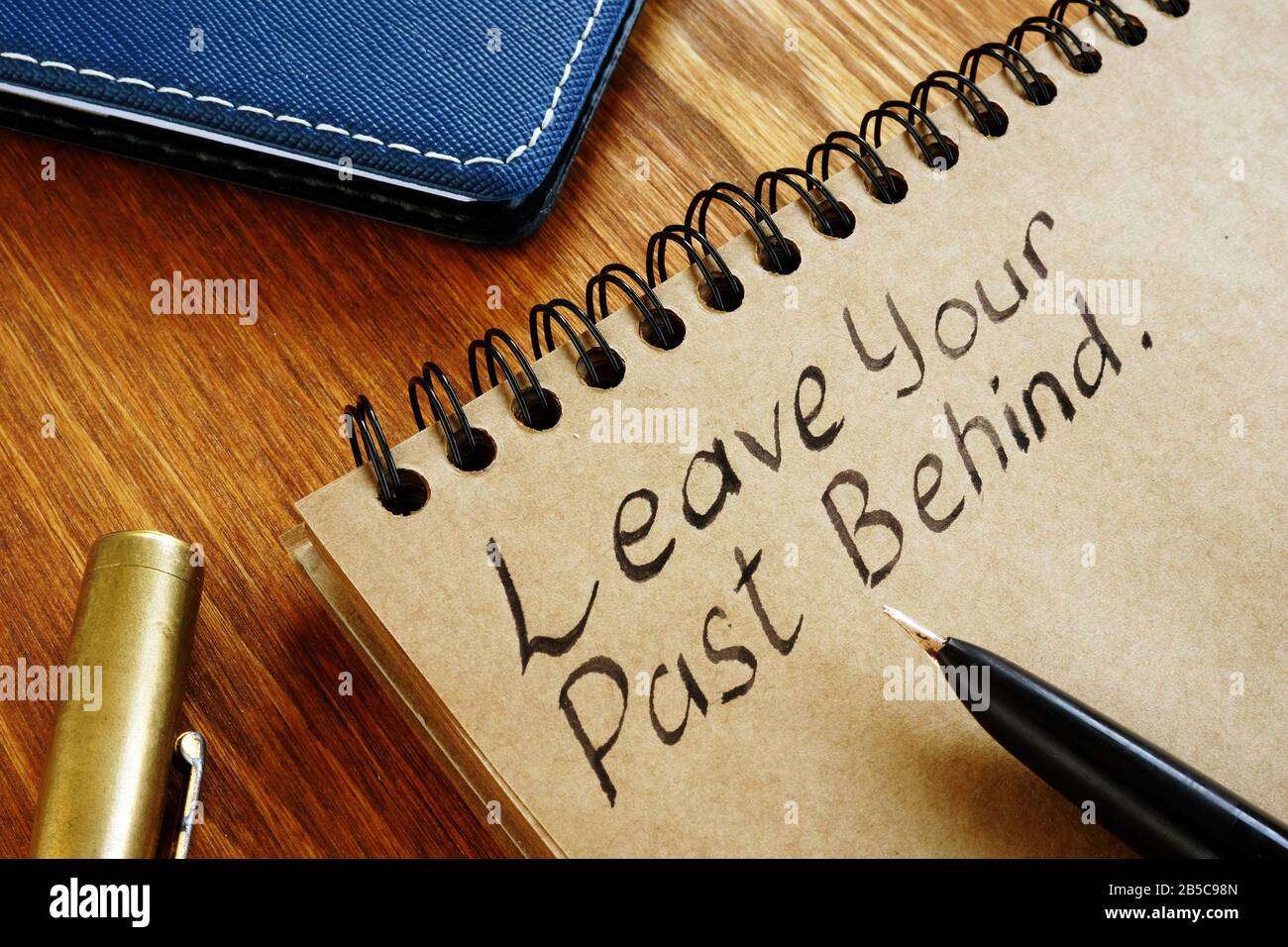 Leave Your Past Behind written phrase Stock Photo - Alamy