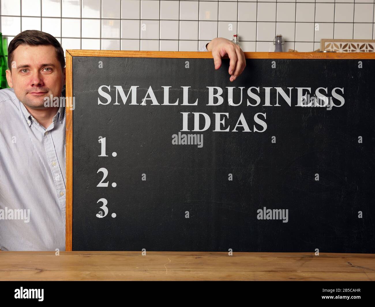 Small business ideas list and businessman Stock Photo - Alamy