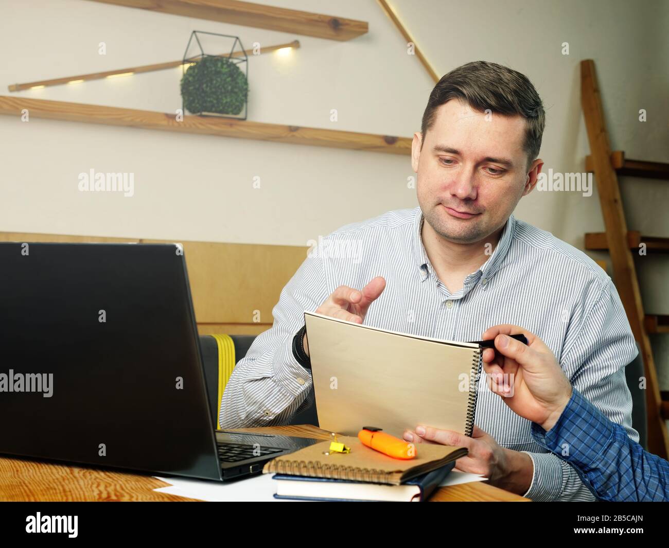 Colleagues check documents and financial report. Paper teamwork in the ...