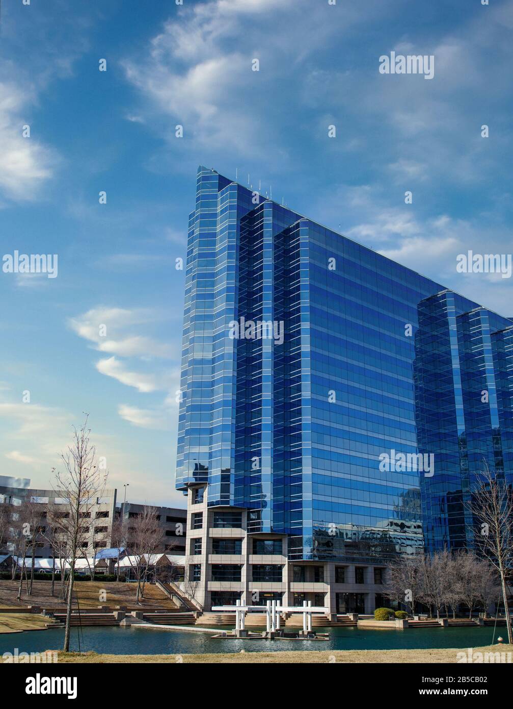 Blue Angled Office Building by Lake Stock Photo - Alamy