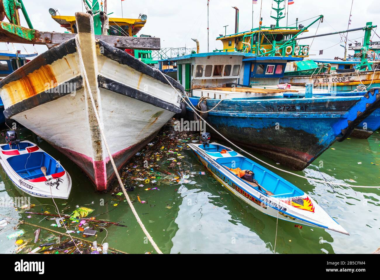 Local fishing boats tied up at Sandakan harbour on Sulu Sea, Sabah ...