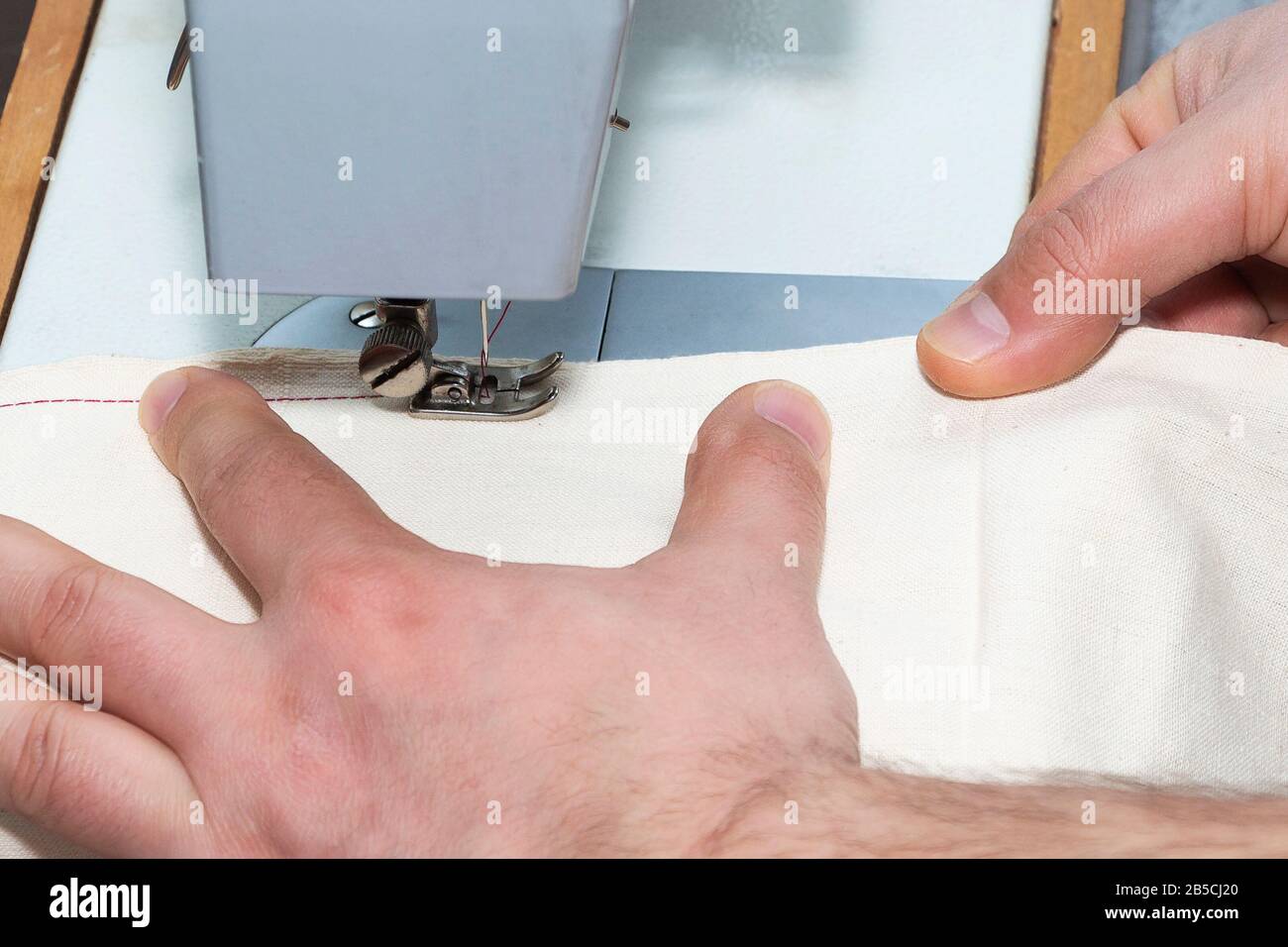 Shuttle a needle. Part of the sewing machine close-up Stock Photo - Alamy
