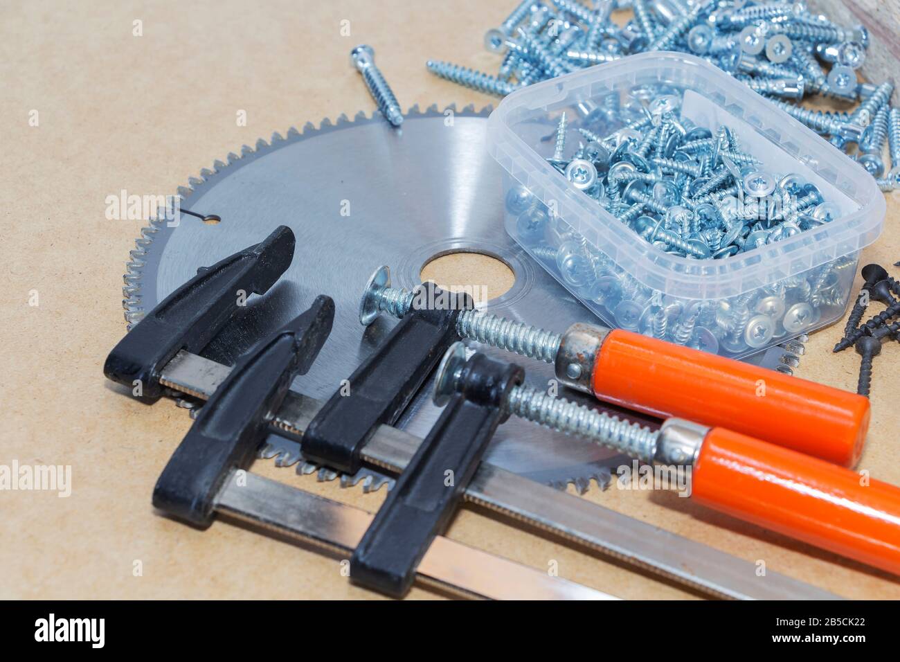 Screws, confirmations for furniture, tape measure, clamp, lie on the ...