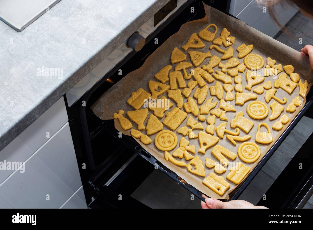 Woman hand take christmas cookies hi-res stock photography and images ...