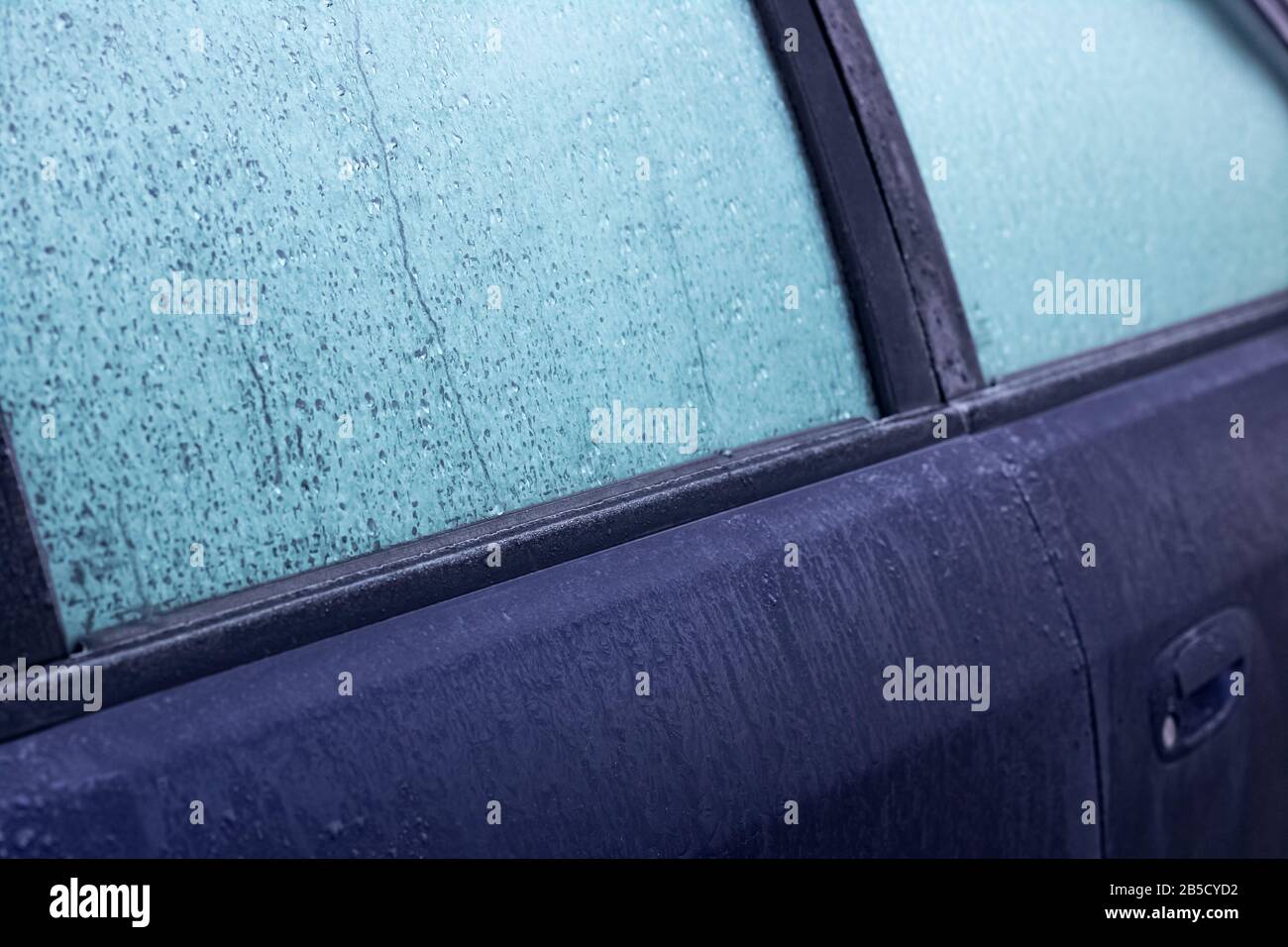 The icy side window of a black car Stock Photo - Alamy
