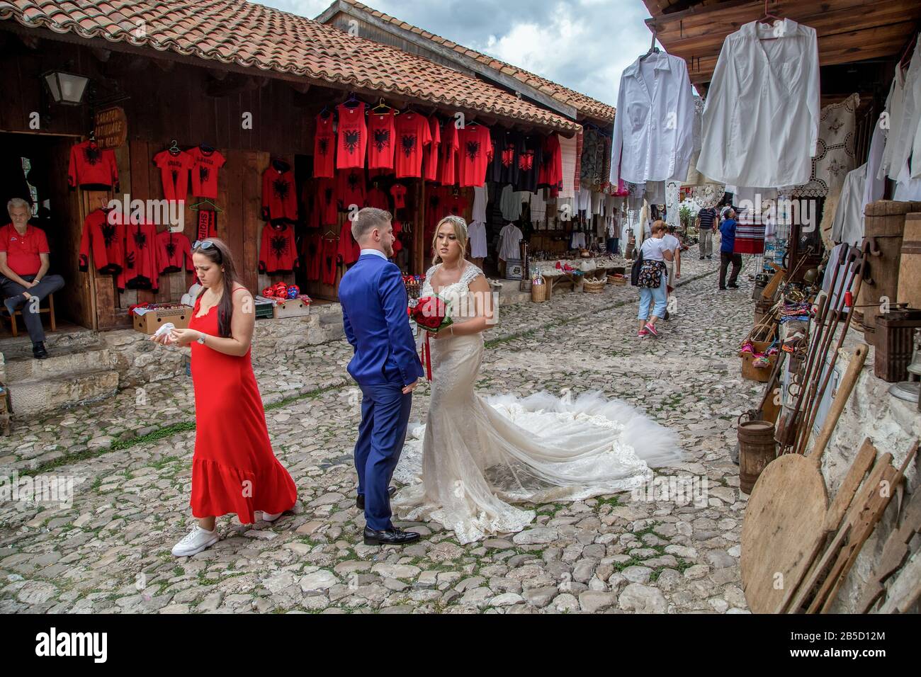 Wedding couple getting ready for photography on the street of Kruja's ...