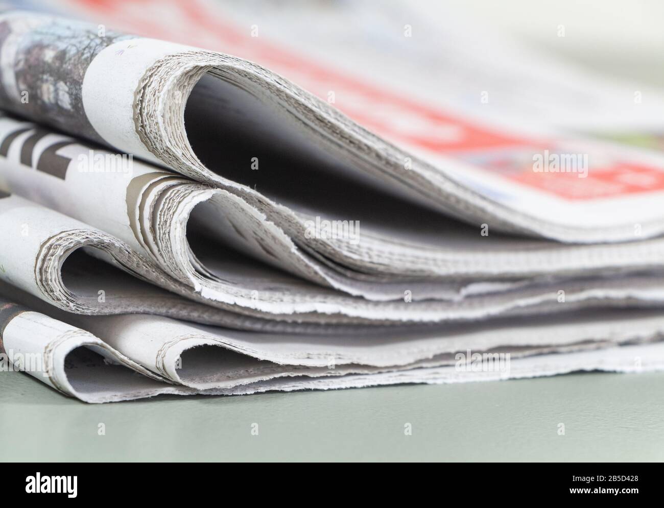 Stack of newspapers on table hi-res stock photography and images - Alamy