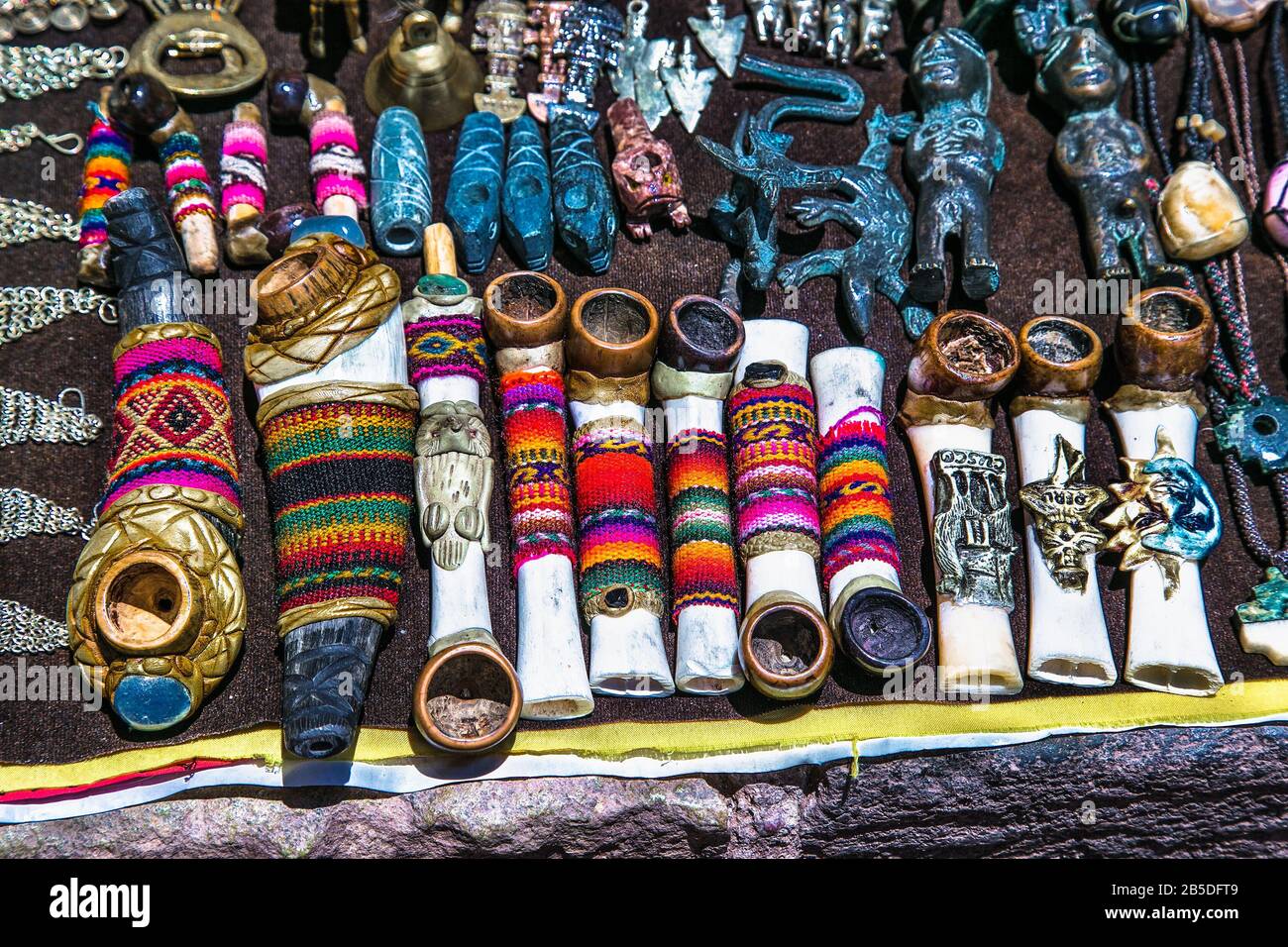 Pipes and souvenirs at a street market in Cusco, Peru Stock Photo - Alamy