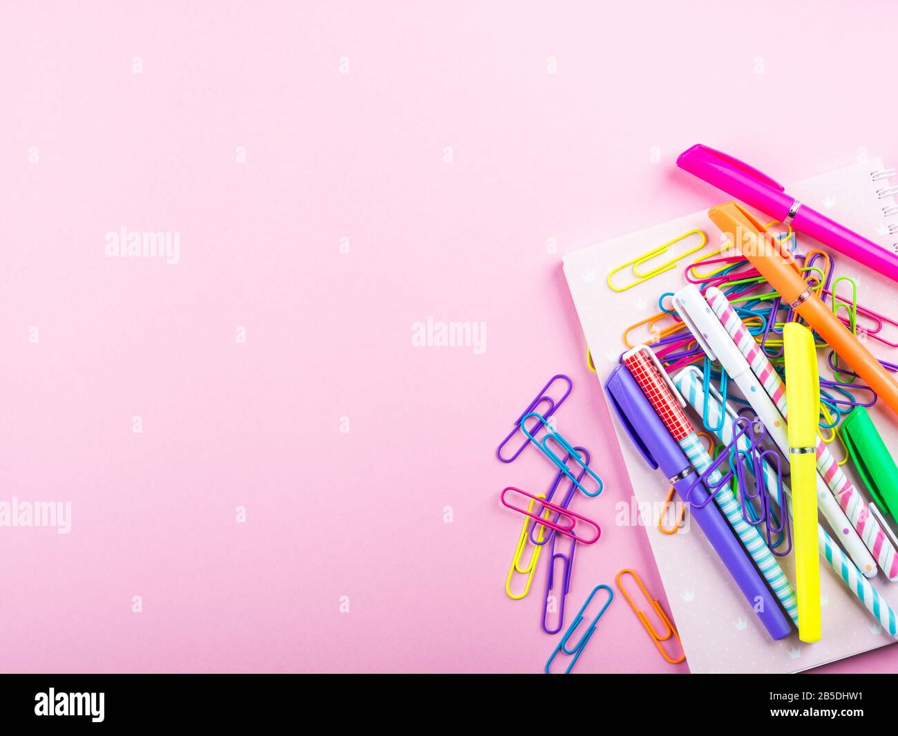 Colorful stationery office supply frame on pink Stock Photo - Alamy