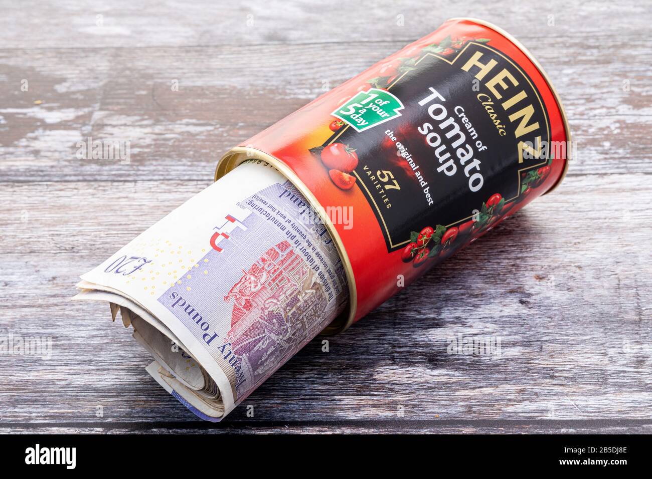 Money cans hi-res stock photography and images - Alamy