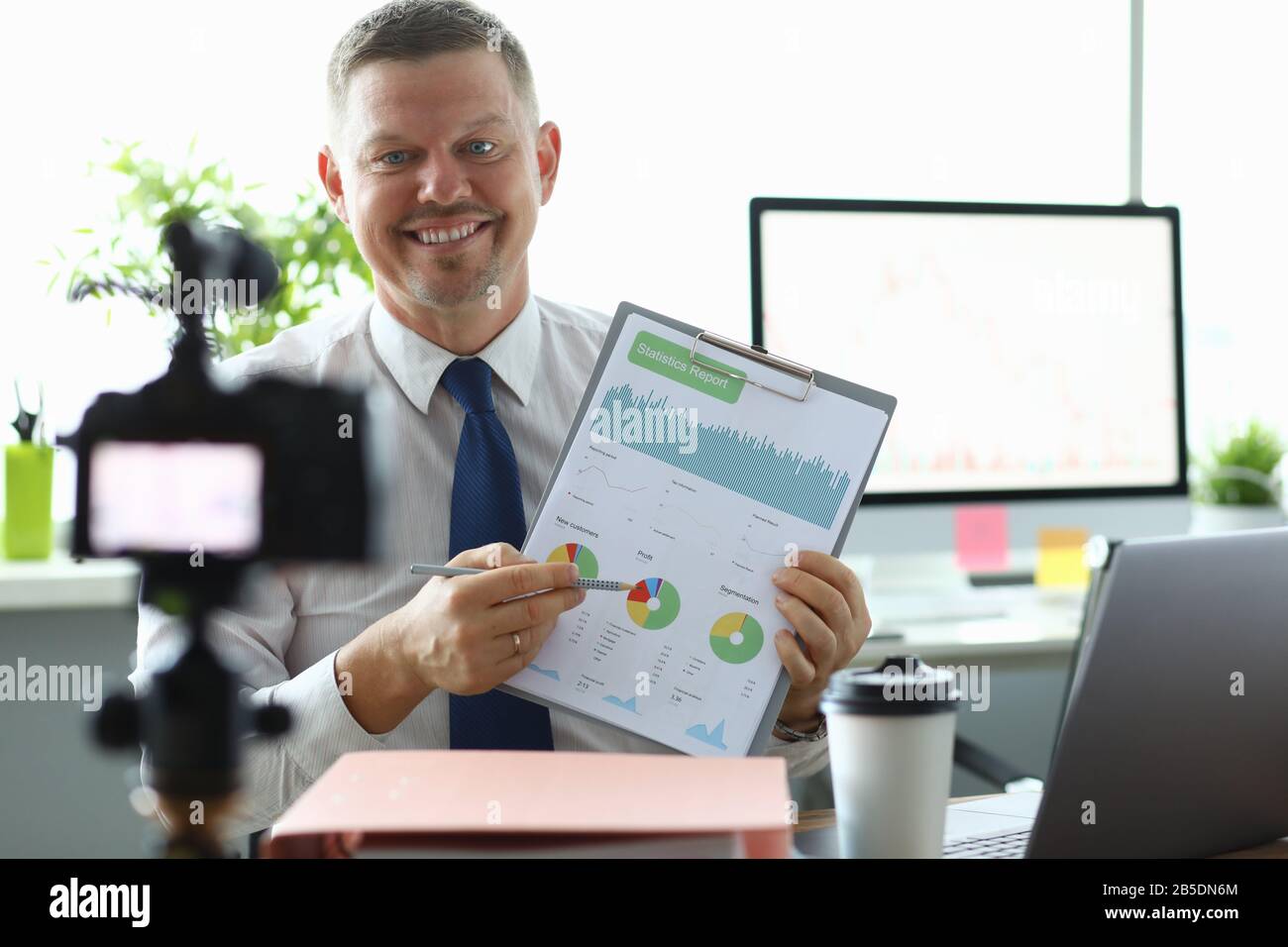Smiling vlogger in office Stock Photo - Alamy