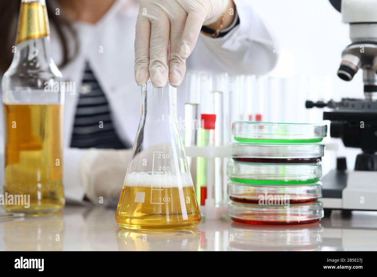 Researcher mixing test tube in lab Stock Photo - Alamy
