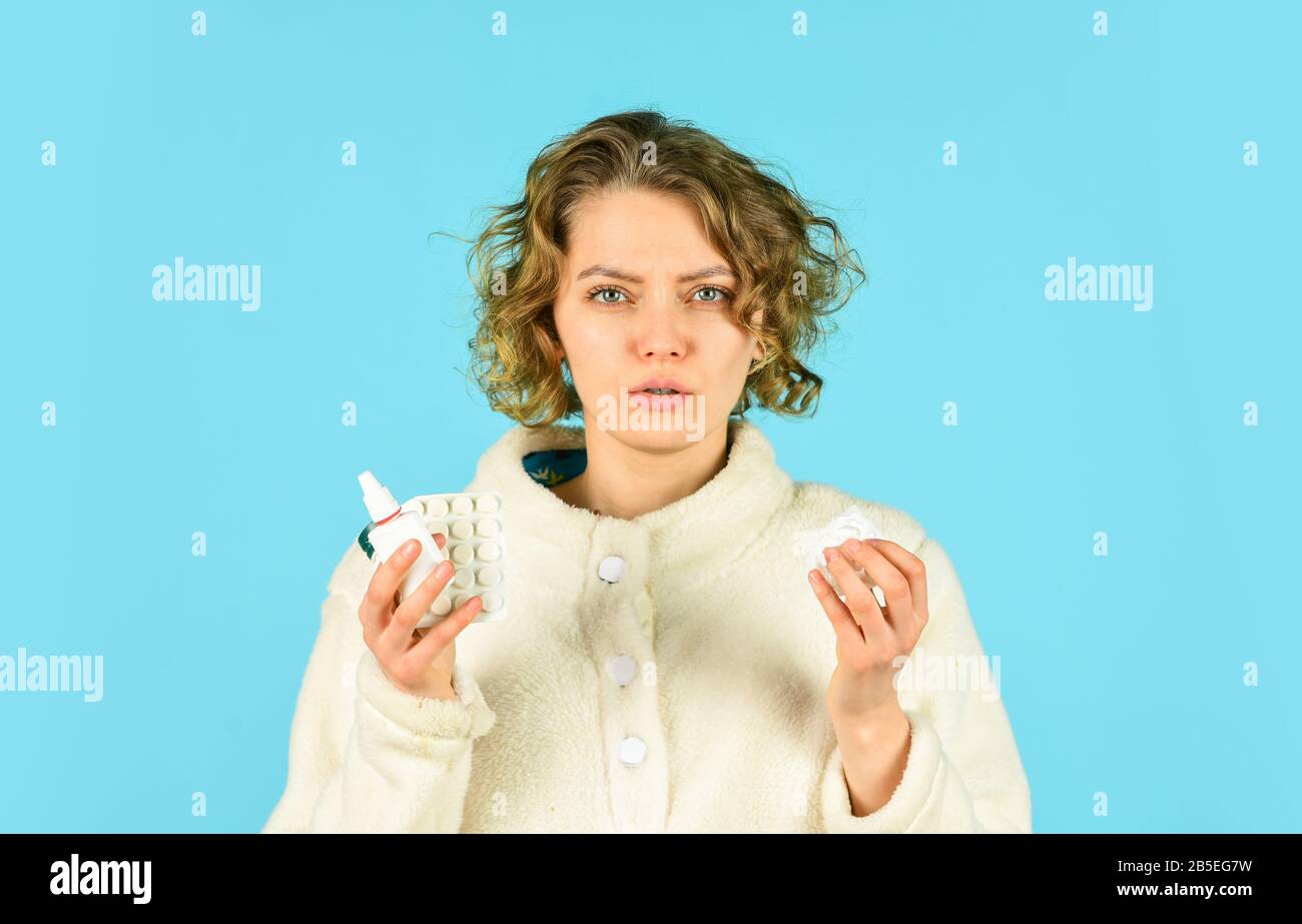 nCoV strain. female health concept. woman with cold flu use nasal spray ...