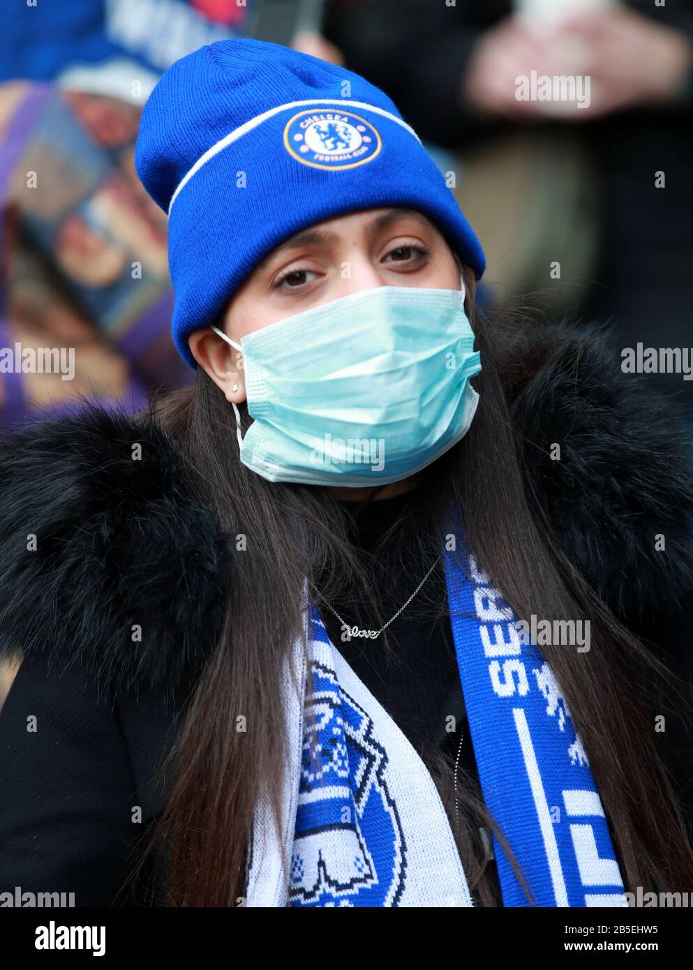 A fan in a mask during the Premier League match at Stamford Bridge ...