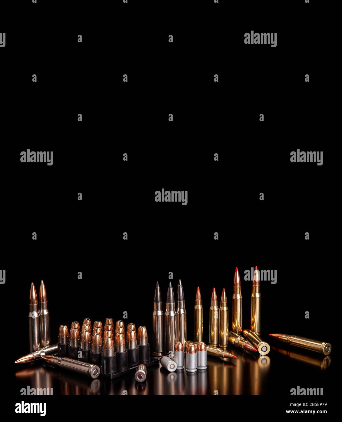 Various cartridges for different weapons and different caliber on a ...