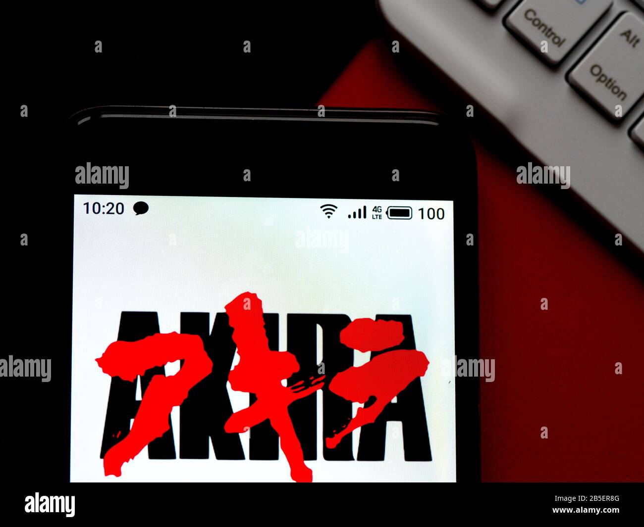 In this photo illustration an Akira logo seen displayed on a smartphone ...