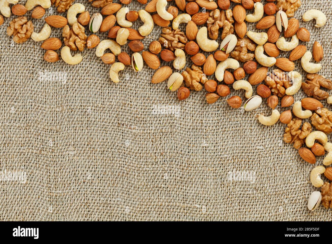 Mix of nuts of cashew, almonds, pistachios, hazelnuts and walnuts is ...
