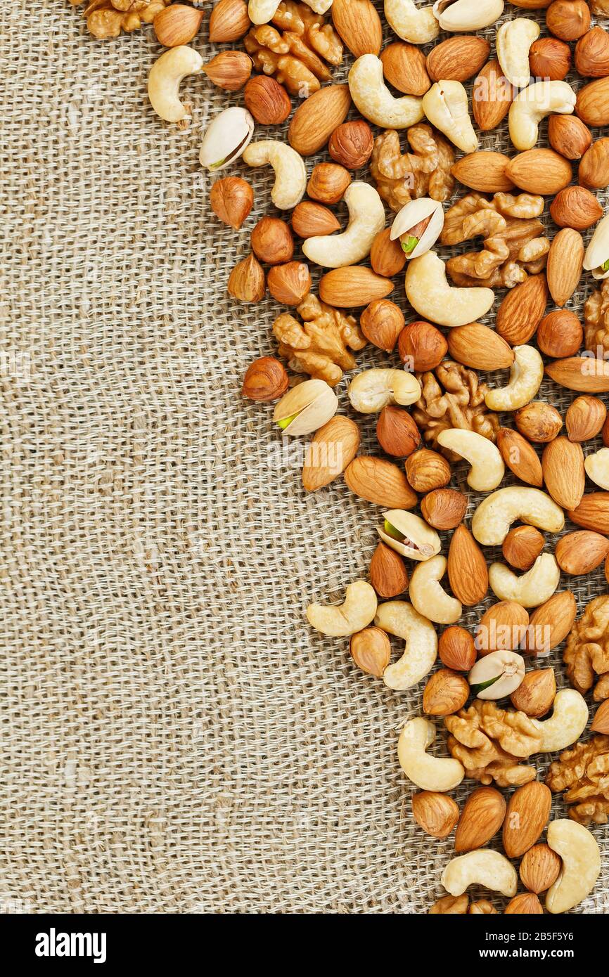 Mix of nuts of cashew, almonds, pistachios, hazelnuts and walnuts is ...