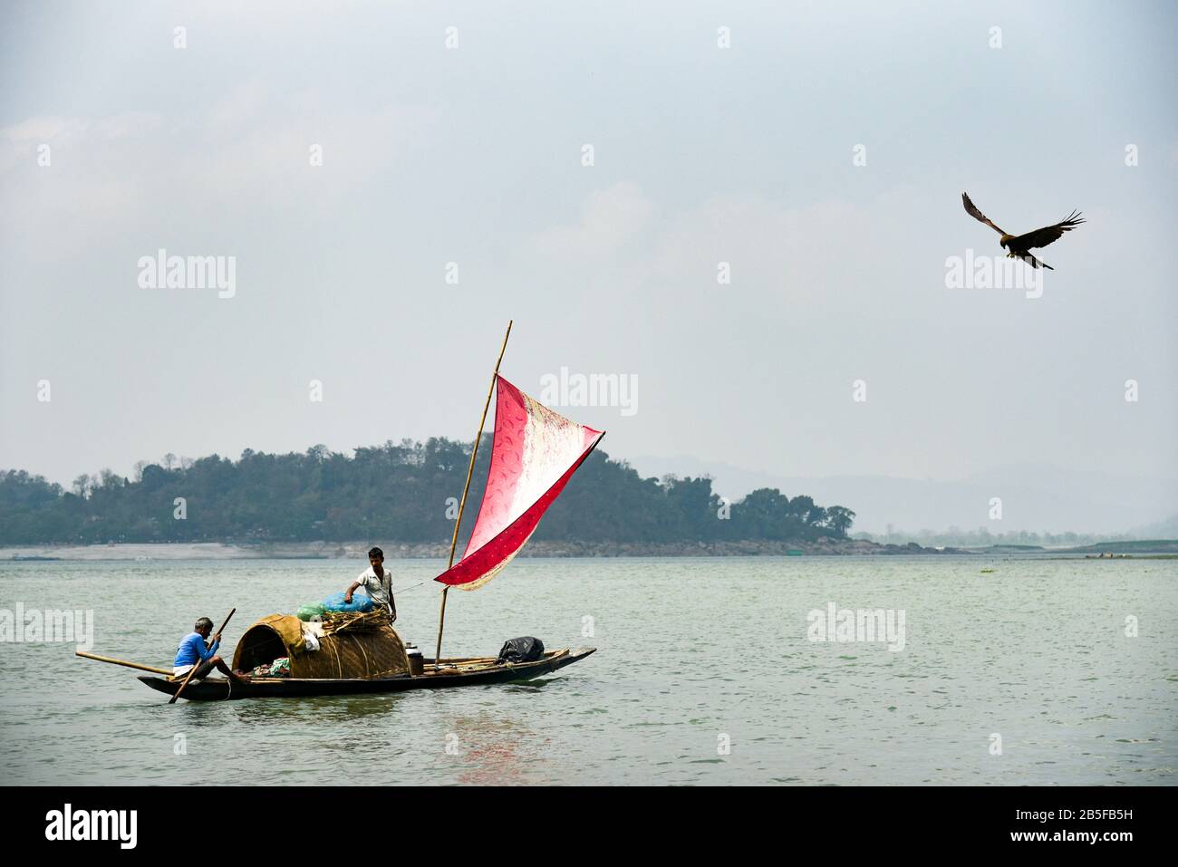 March 8, 2020, Guwahati, Assam, India: Fishermen on his boat in the ...