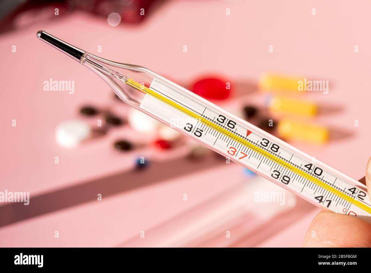 Medical thermometer close up on colorful blurry background Stock Photo ...