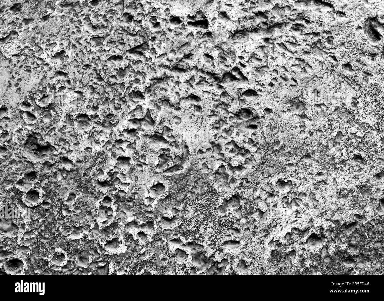 Many rugged holes on the gray concrete floor Stock Photo - Alamy