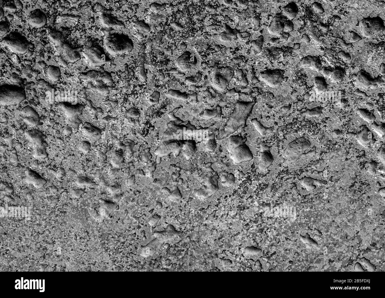 Many rugged holes on the rusty color concrete floor Stock Photo - Alamy