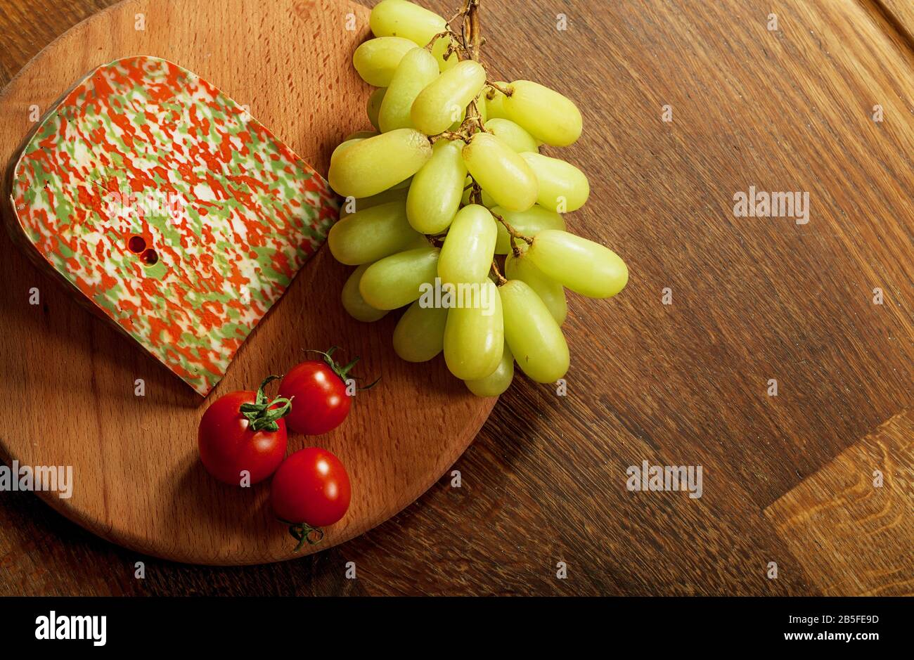 Expensive elite cheese on a wooden background Stock Photo - Alamy