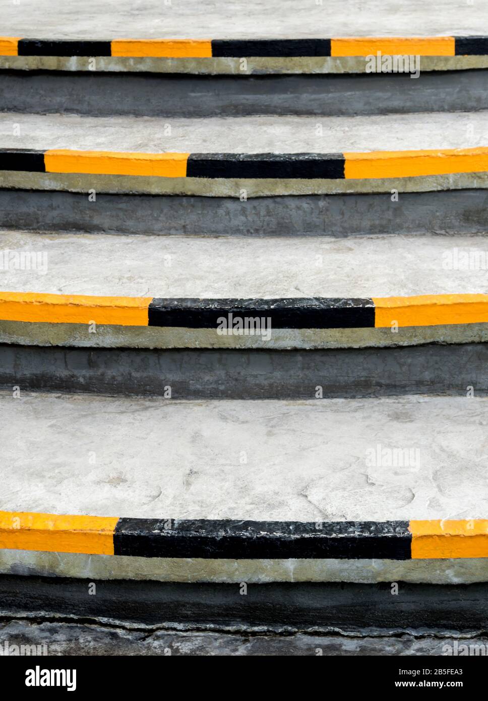 Yellow and black stripes, safety symbols at the edge of the stairs ...