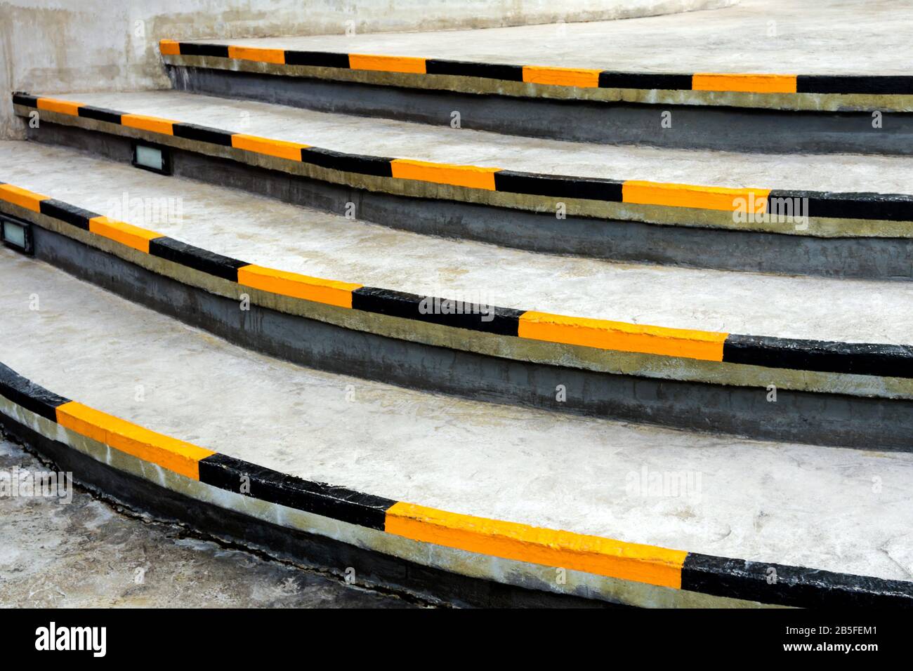 Yellow and black stripes, safety symbols at the edge of the stairs ...