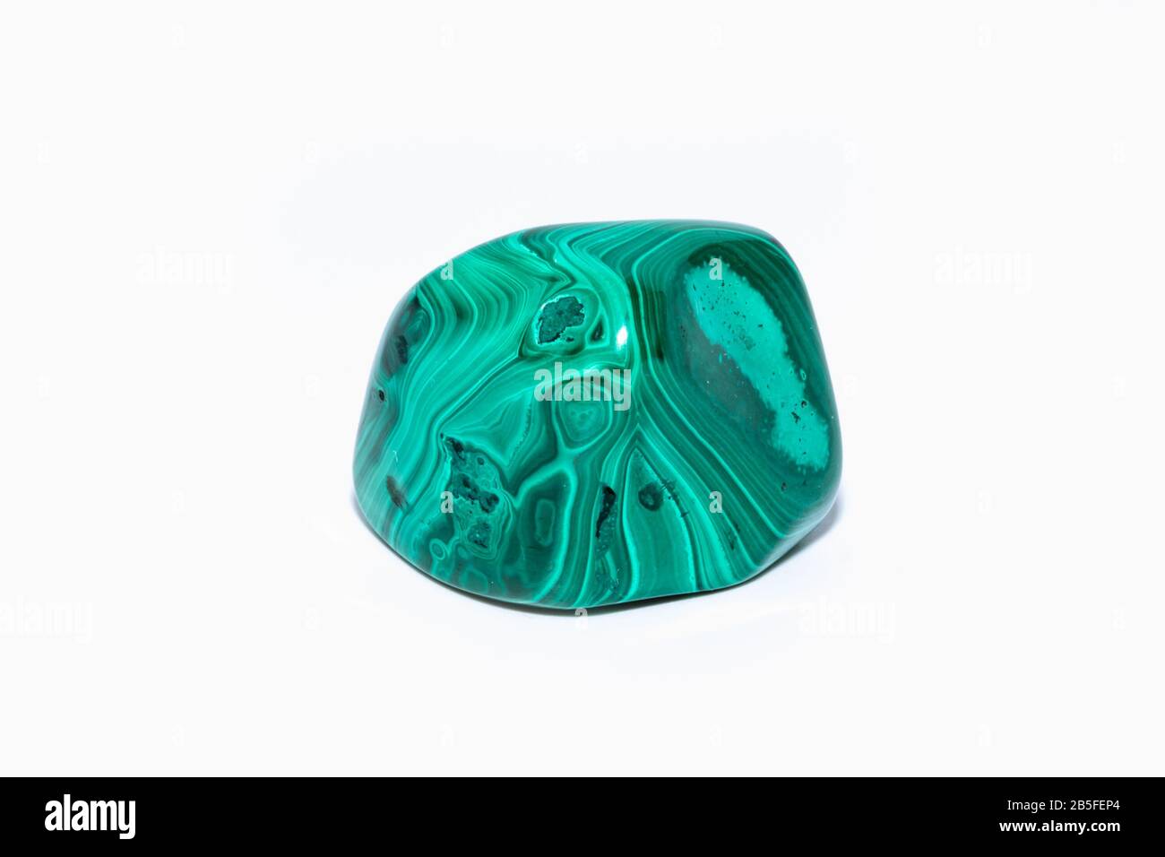 A sample of the mineral malachite on a white background Stock Photo - Alamy