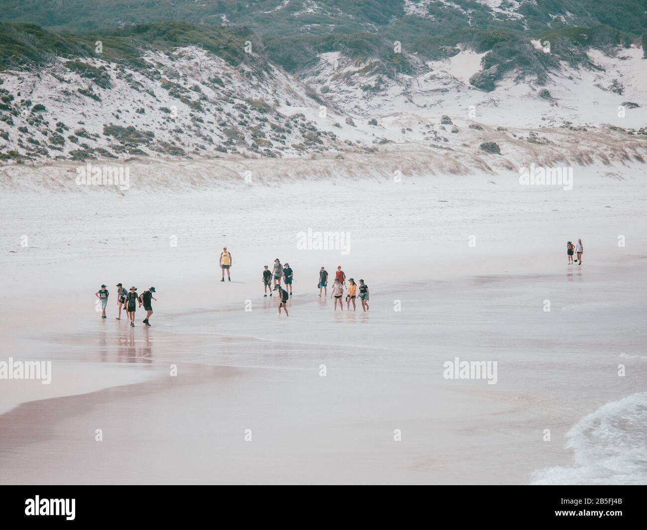 Some tourists on a beach in Australia Stock Photo - Alamy