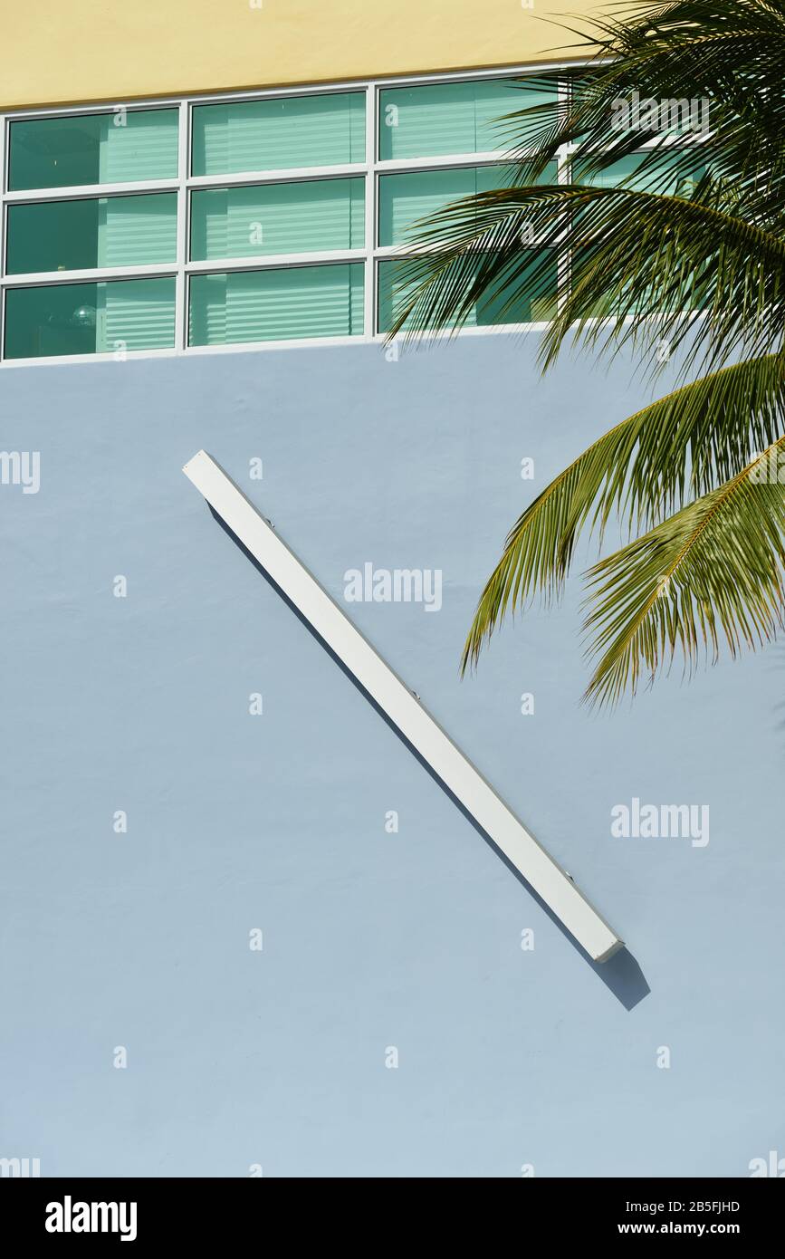Tropical deco facade with geometric patterns and palm tree Stock Photo ...