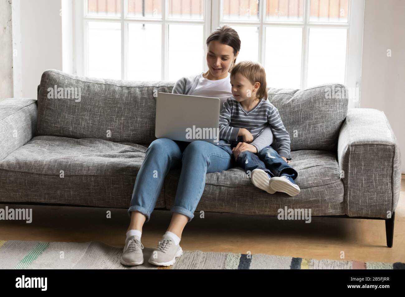 Watch movies on computer hi-res stock photography and images - Alamy