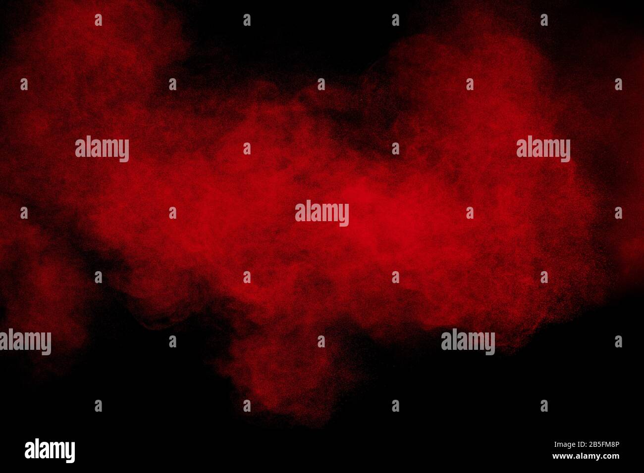 Abstract explosion of red powder on black background Freeze motion of ...