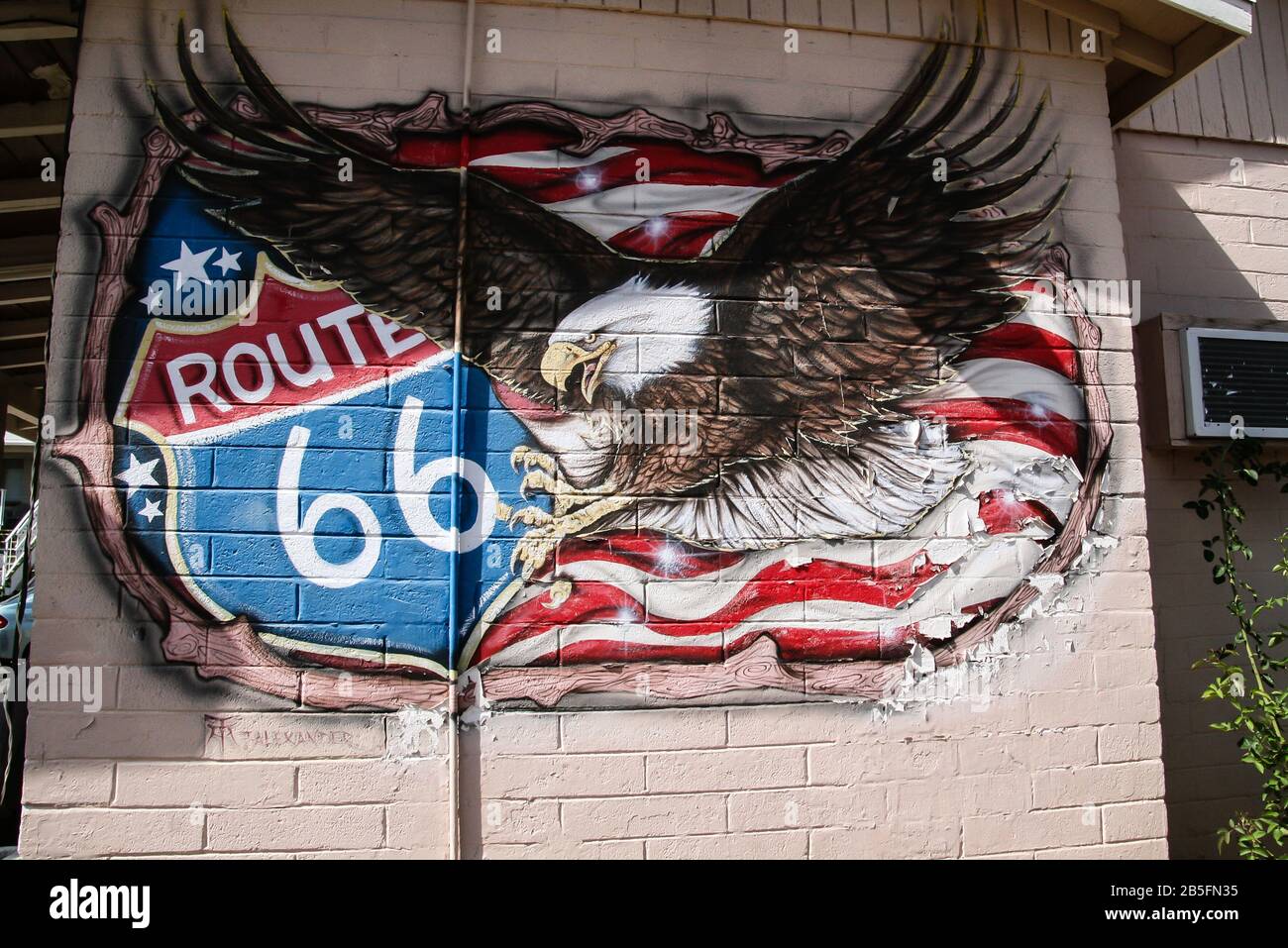 American flag with eagle symbol of the United States on a route 66 wall ...