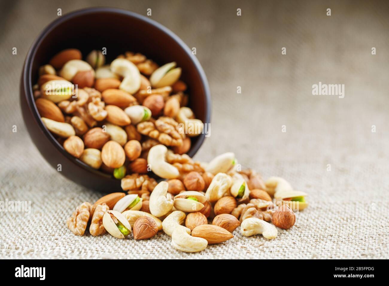 Mix of nuts of cashew, almonds, pistachios, hazelnuts and walnuts is ...
