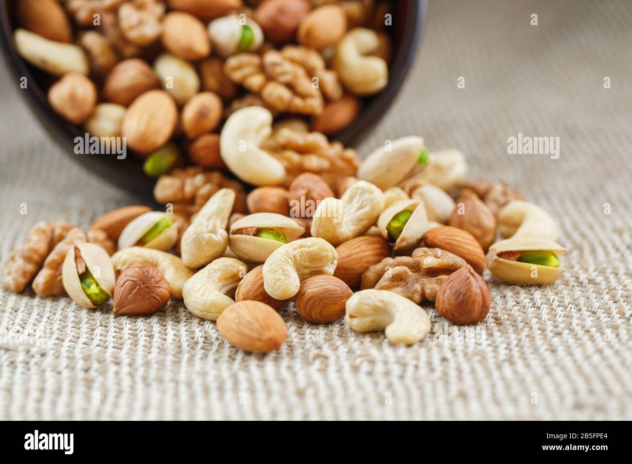 Mix of nuts of cashew, almonds, pistachios, hazelnuts and walnuts is ...