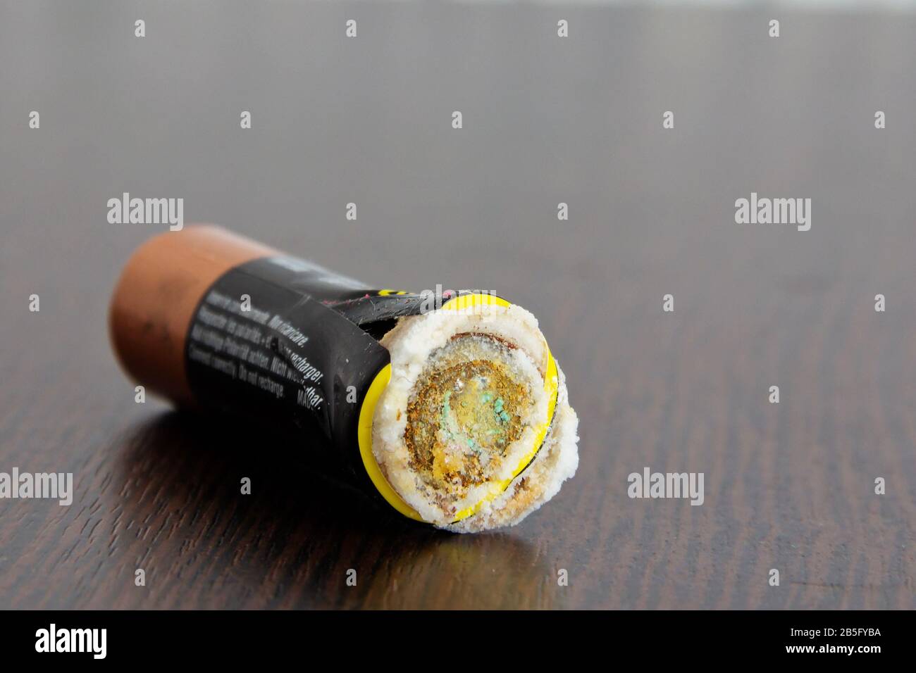 A worn-out electric battery. Leaked electric battery Stock Photo - Alamy