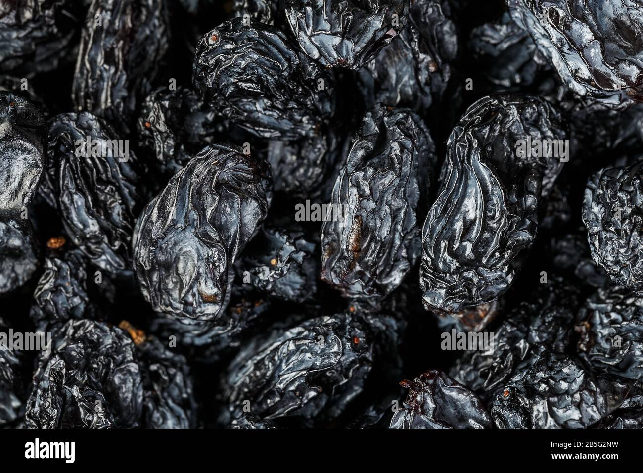 Black Raisin texture, popular dried fruit. Dried grapes. Red seedless ...