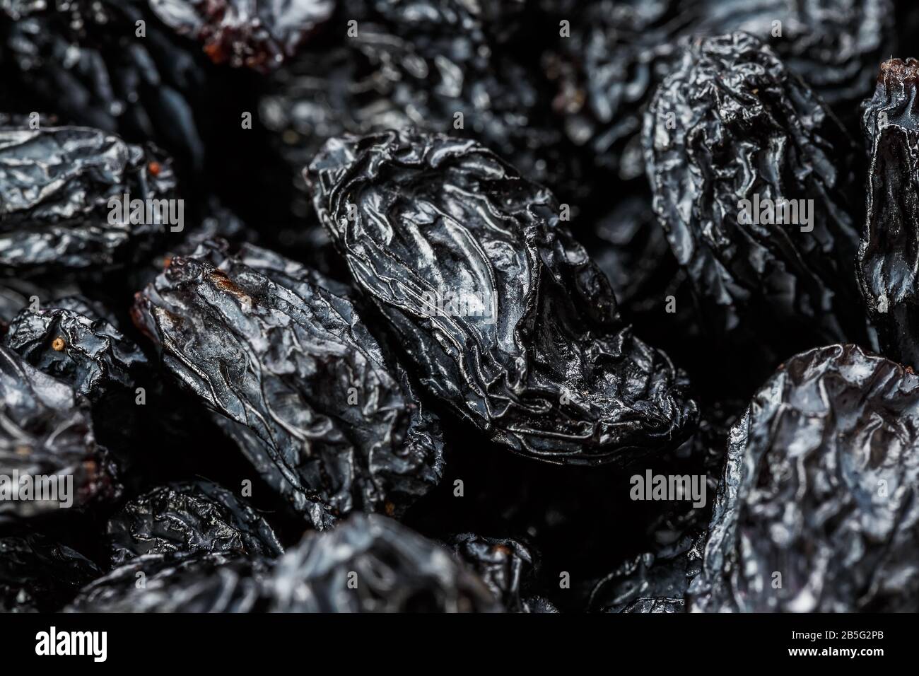 Black Raisin texture, popular dried fruit. Dried grapes. Red seedless ...