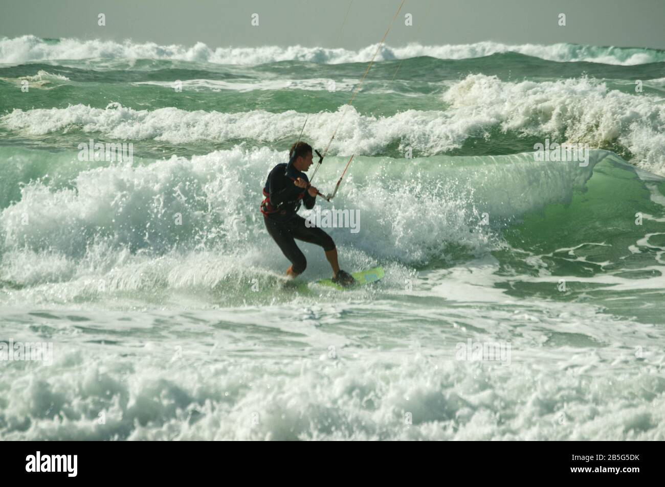 Kitesurfer riding the waves hi-res stock photography and images - Alamy