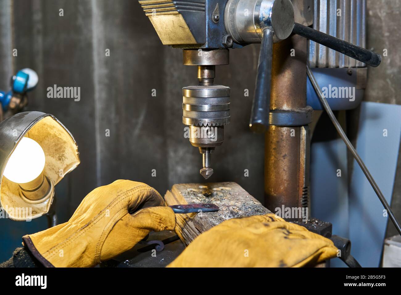machining of metal artwork on a drilling machine with countersink ...