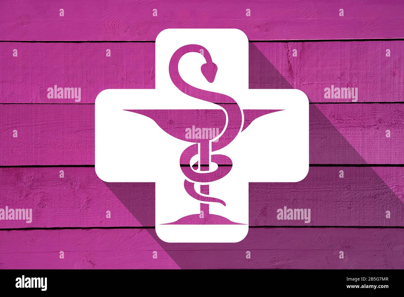 Pharmacy icon in a cross on wood background Stock Photo - Alamy