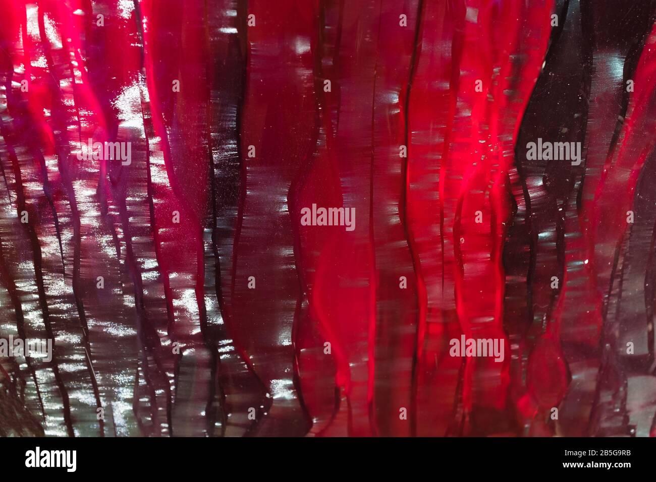 Red ruby glass Textured background, with a green tint Stock Photo - Alamy
