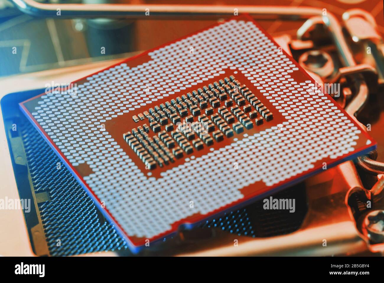 The central processor on the computer motherboard in red colors. PC ...