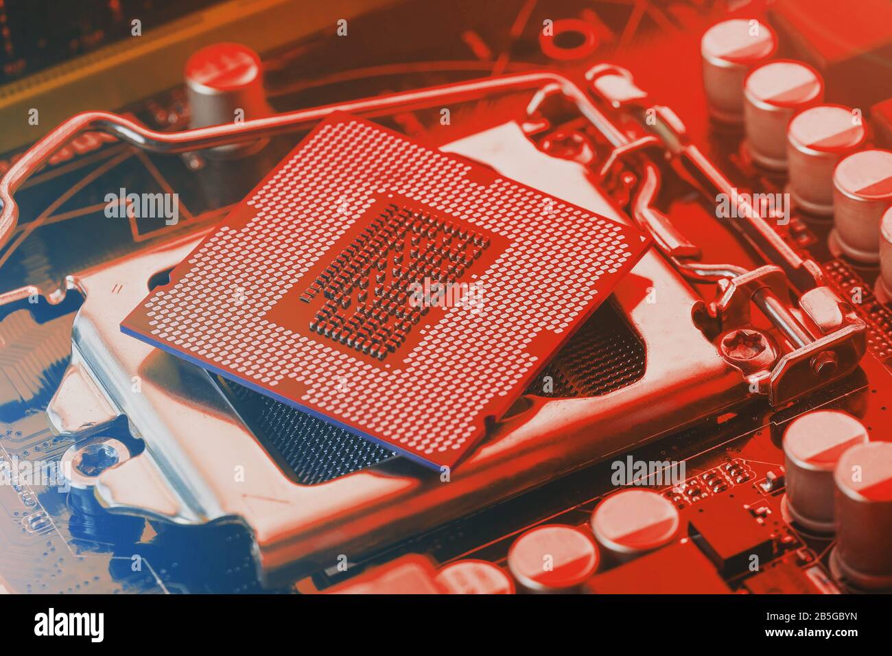 The Central Processor On The Computer Motherboard In Red Colors. Pc