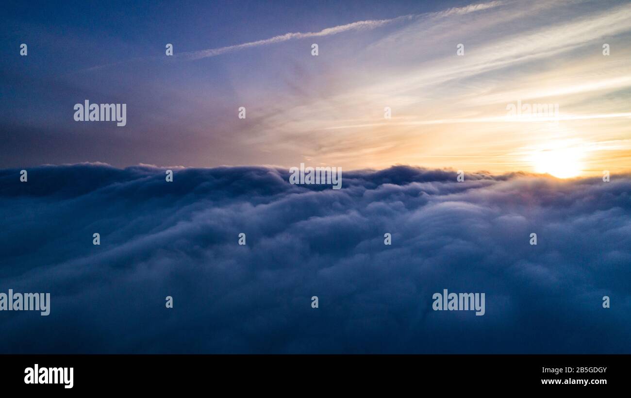 Aerial view Mystical gray winter clouds piled up against the backdrop ...